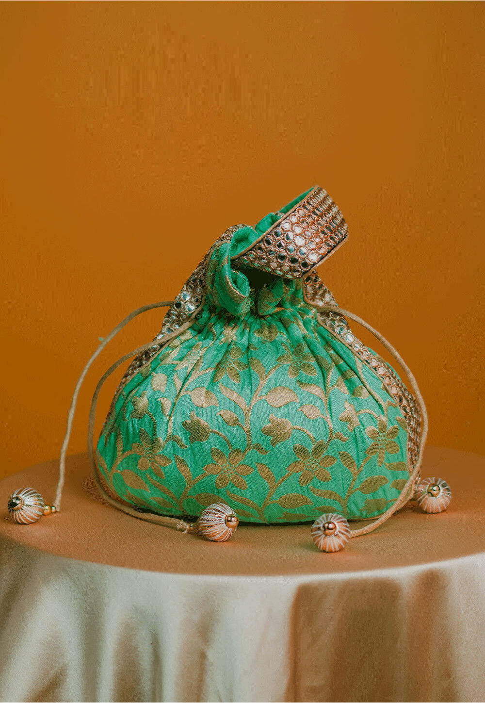 Buy Brocade Silk Potli Bag in Pastel Blue Online : DMQ254 - Utsav Fashion