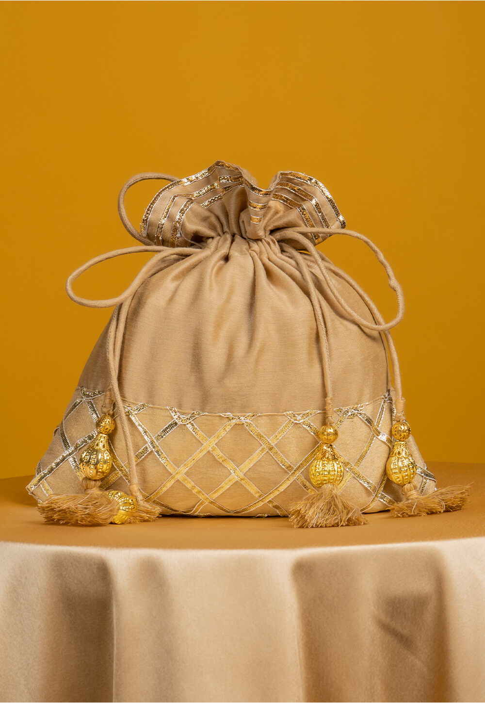 Buy Embroidered Art Silk Potli Bag in Beige Online : DMQ260 - Utsav Fashion