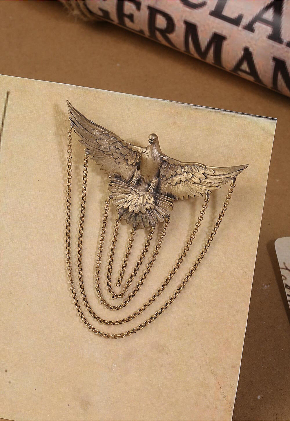 Buy Flying Phoenix Metallic Brooch Online : MTE1968 - Utsav Fashion