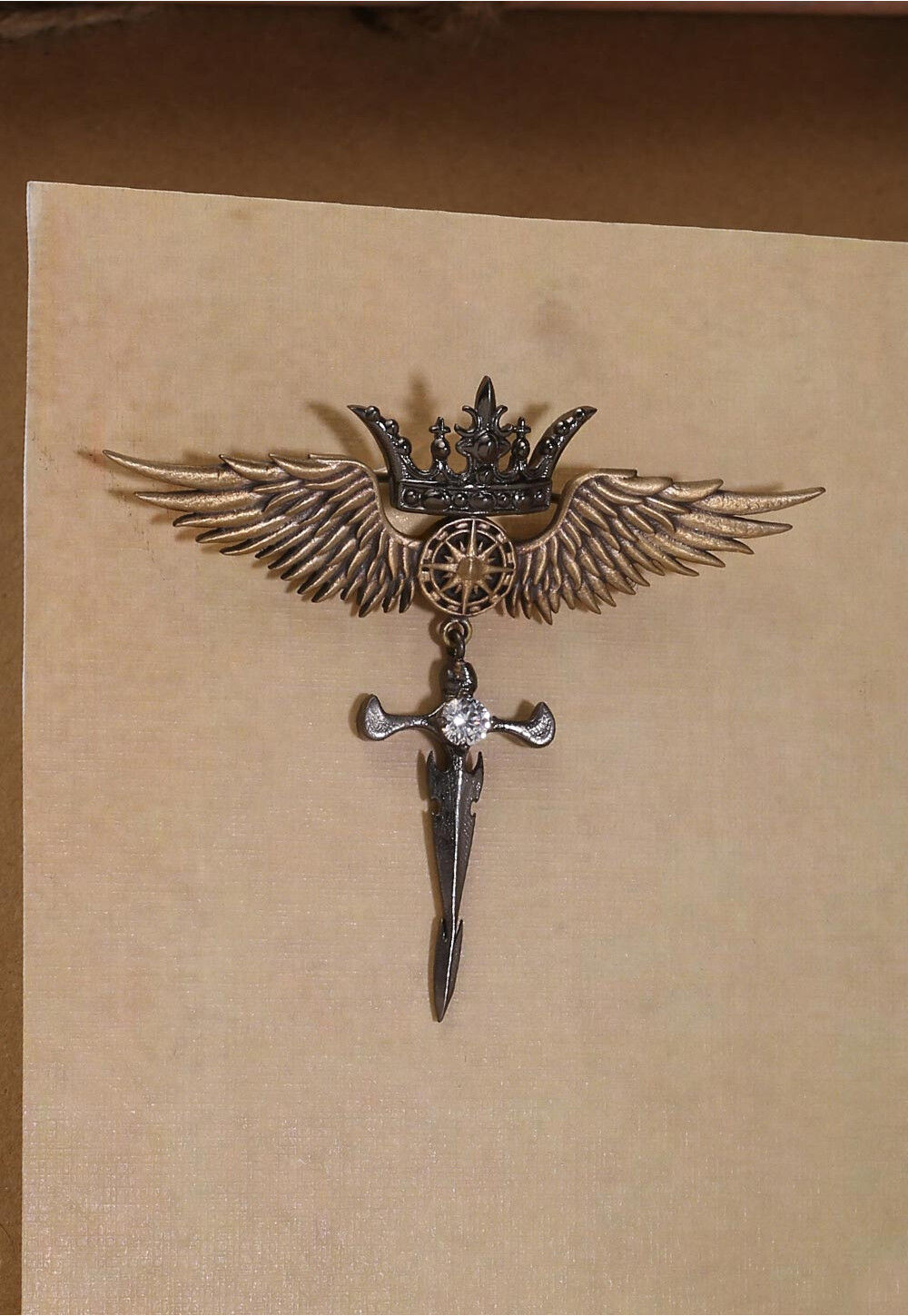 Buy The Crowned Phoenix Metallic Brooch Online : MTE1975 - Utsav Fashion